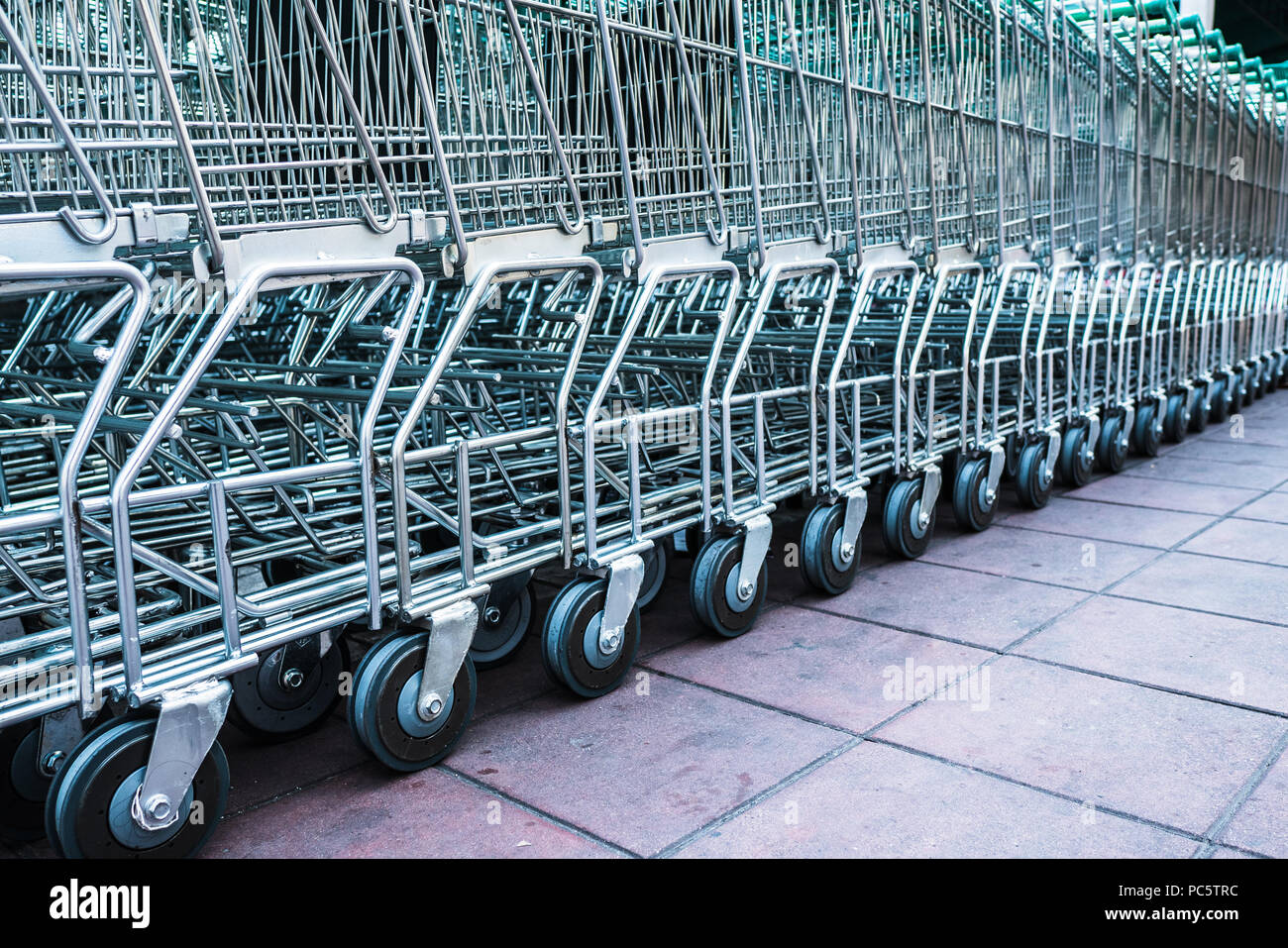 Shopping cart wheels Stock Photo - Alamy