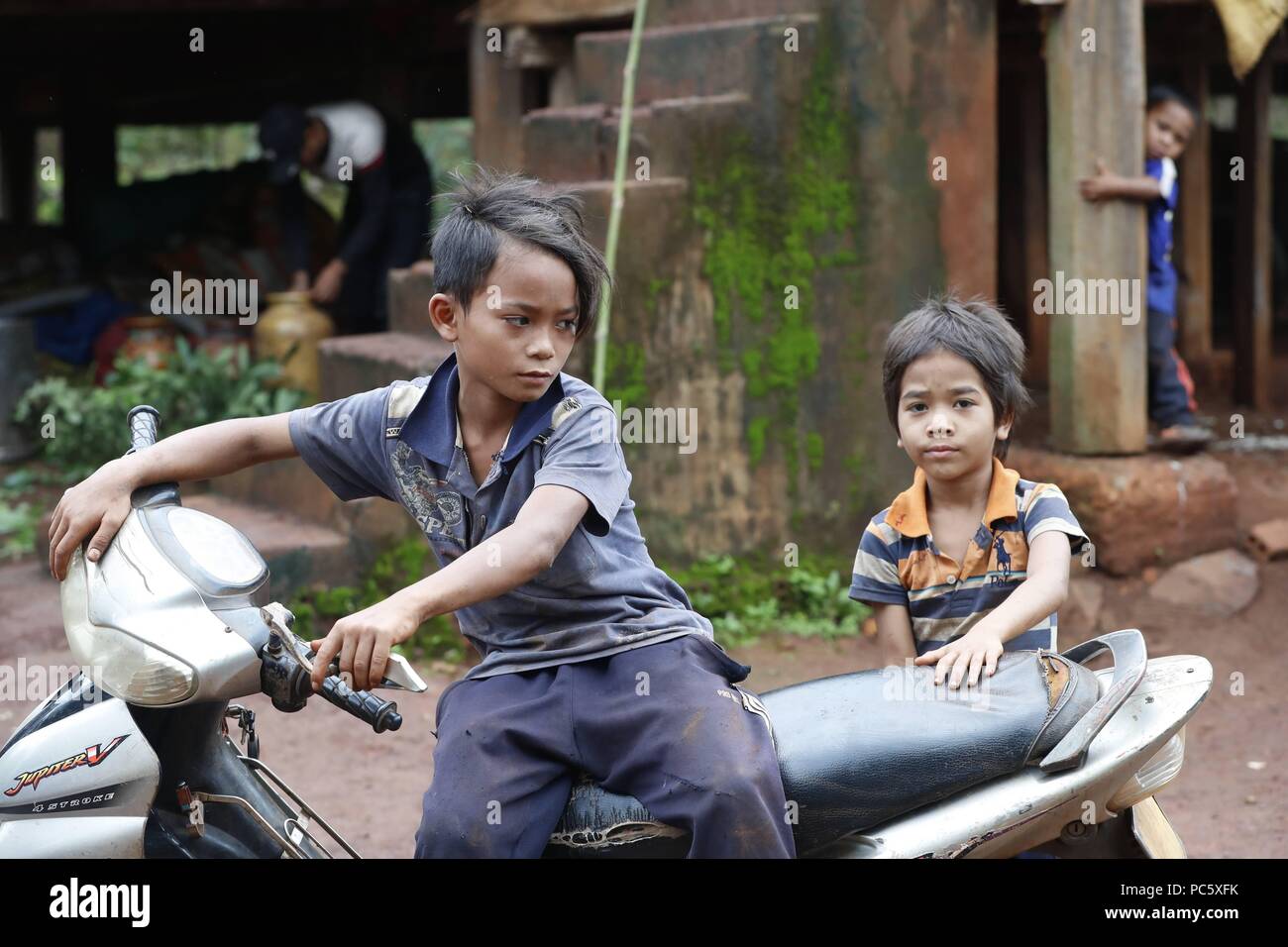 Jarai (Gia Rai) ethnic group. Children on a motorbike. Kon Tum. Vietnam ...