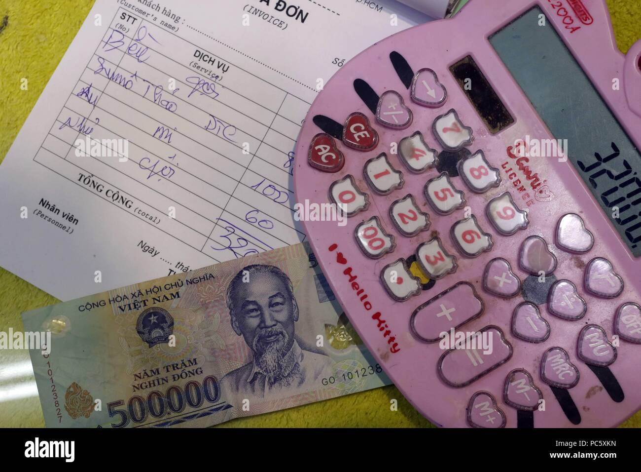 Vietnamese currency, the Dong. Bill with bank note. Ho Chi Minh City ...