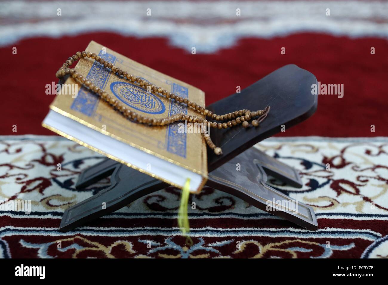 Jamiul Islamiyah Mosque. Holy Quran or Koran with prayer beads ( Tasbih ...