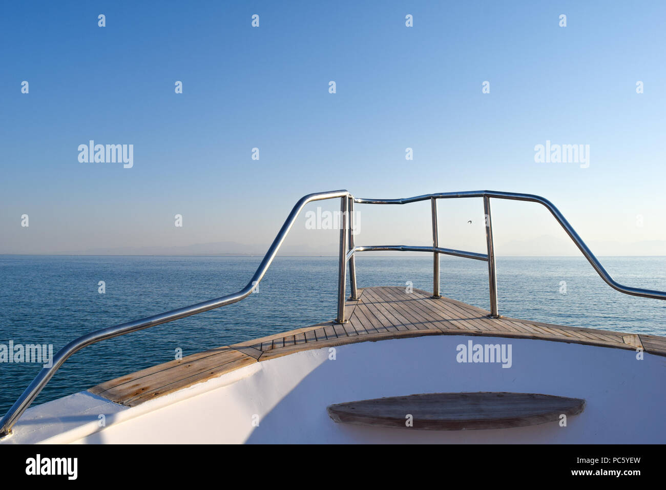 View from yacht over the ocean, horizon in background, blue sky Stock ...