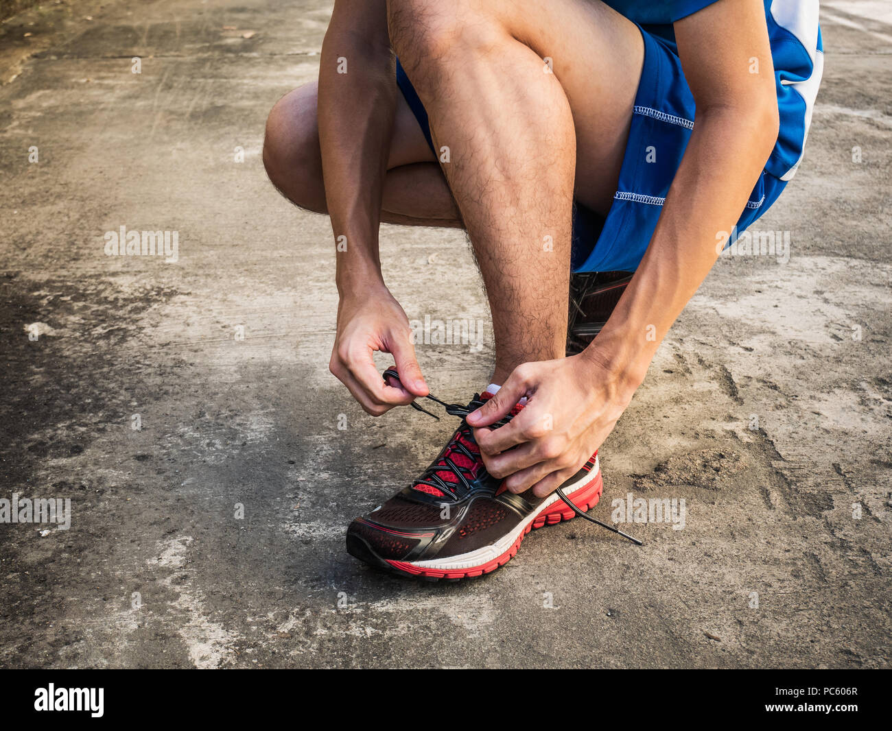 Tying running shoes hi-res stock photography and images - Alamy