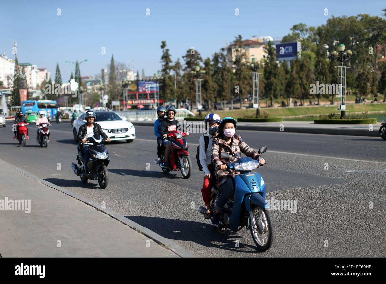 People on the streets of Dalat on scooters. Dalat. Vietnam. | usage ...