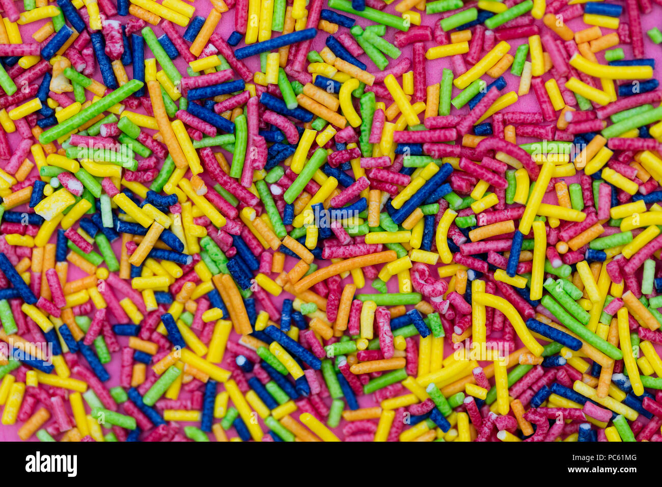 Colourful candy cake decorative sprinkles background Stock Photo - Alamy