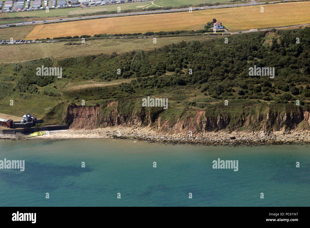 Cayton Bay erosion showing cliff slippage Stock Photo - Alamy