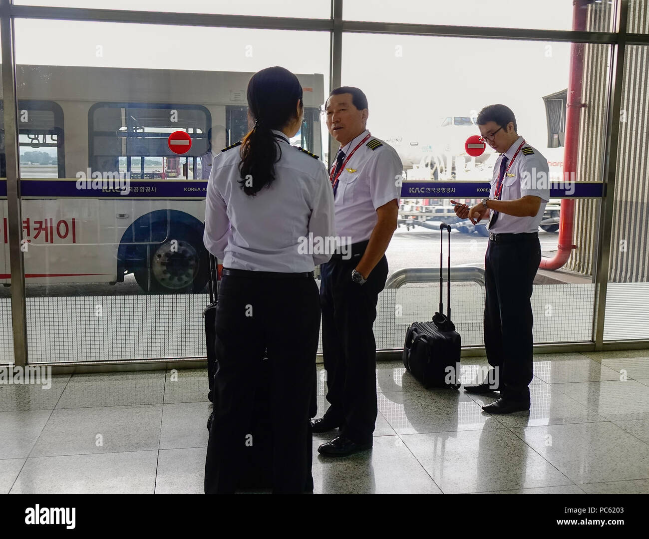 Jeju, South Korea - Sep 21, 2016. Cabin crews and pilots waiting at ...