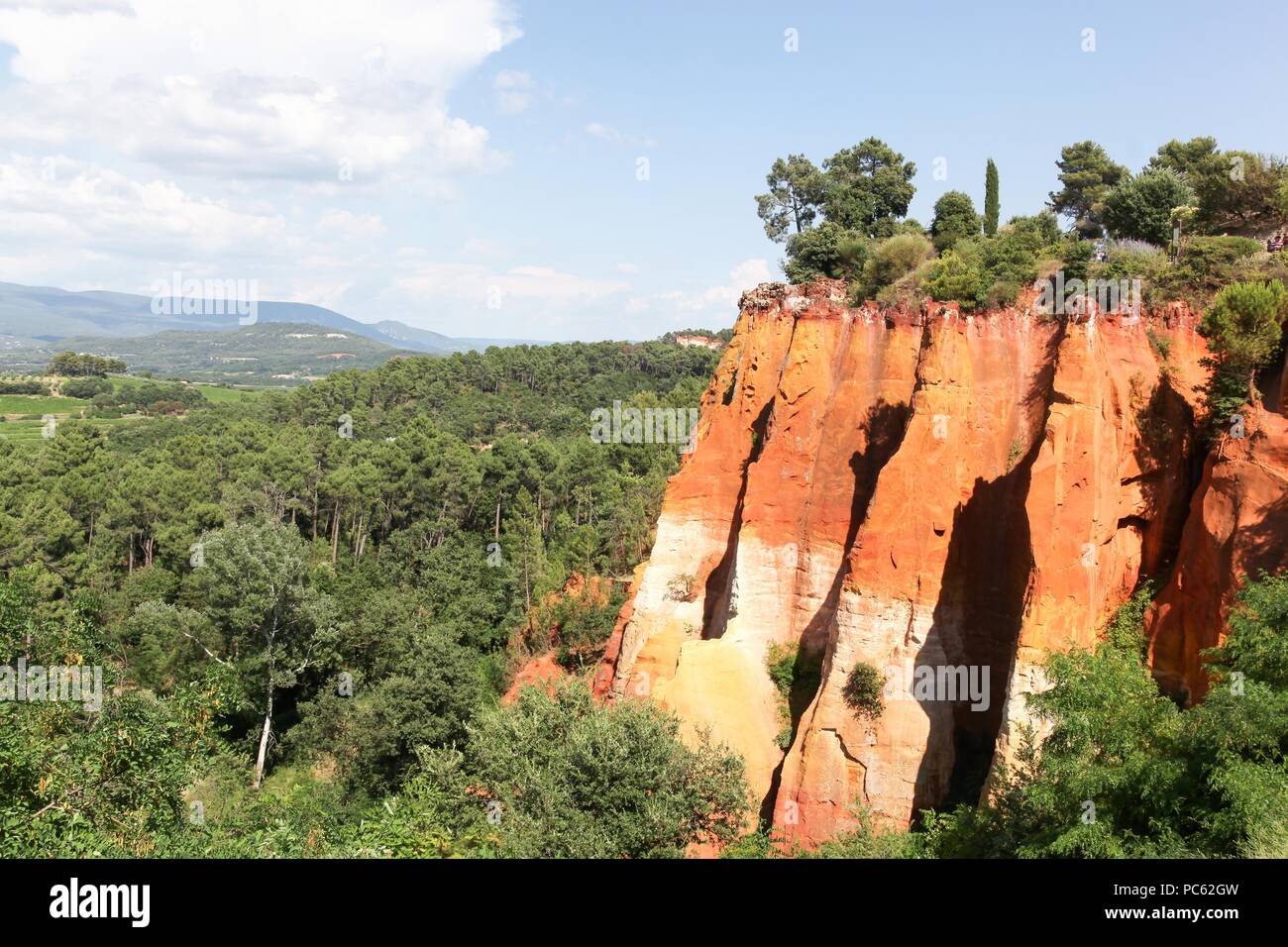 Red ocher cliffs in the village of Roussillon in Provence, France Stock ...