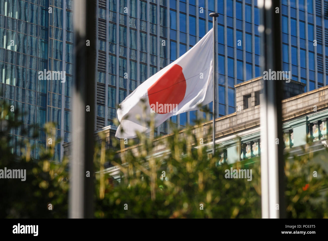 A Japanese flag is seen at Bank of Japan building under construction on ...