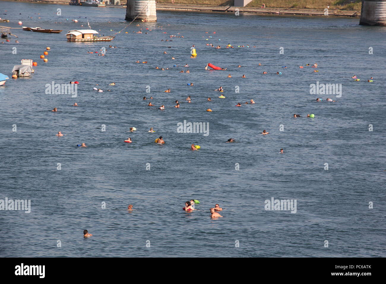 Basel, Switzerland. 31st July 2018. People swimming in the Rhine river ...