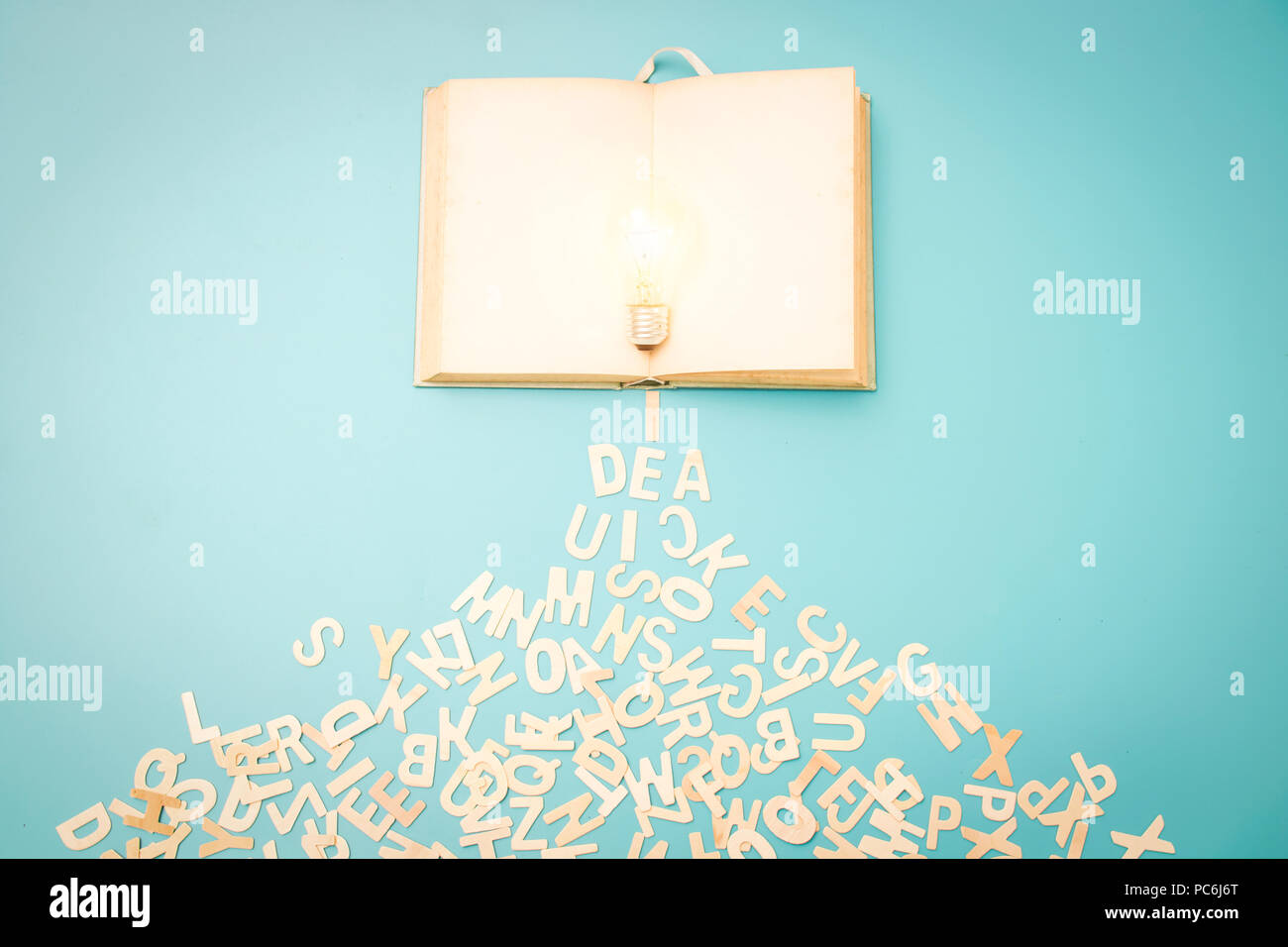 knowledge and idea concept, light bulb on blue background releasing ...