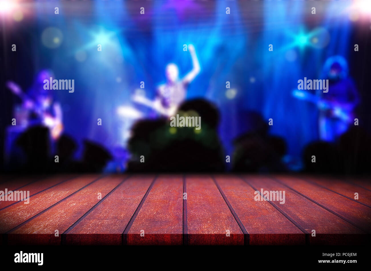 Abstract blurred background.Wooden table or counter and music band on ...