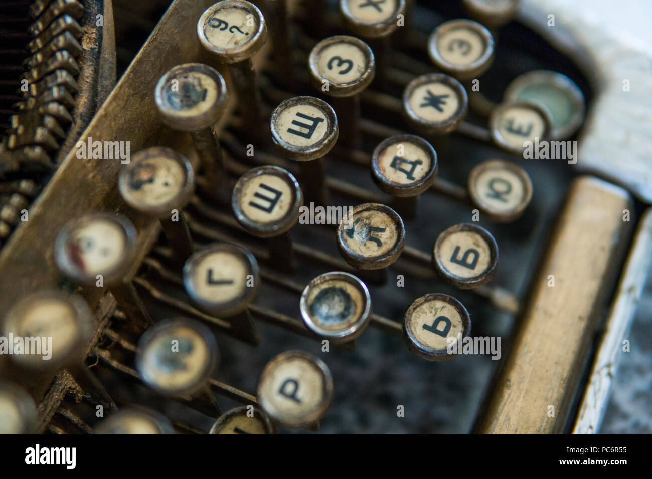 Close up view on an old dirty broken antique typewriter keys with ...