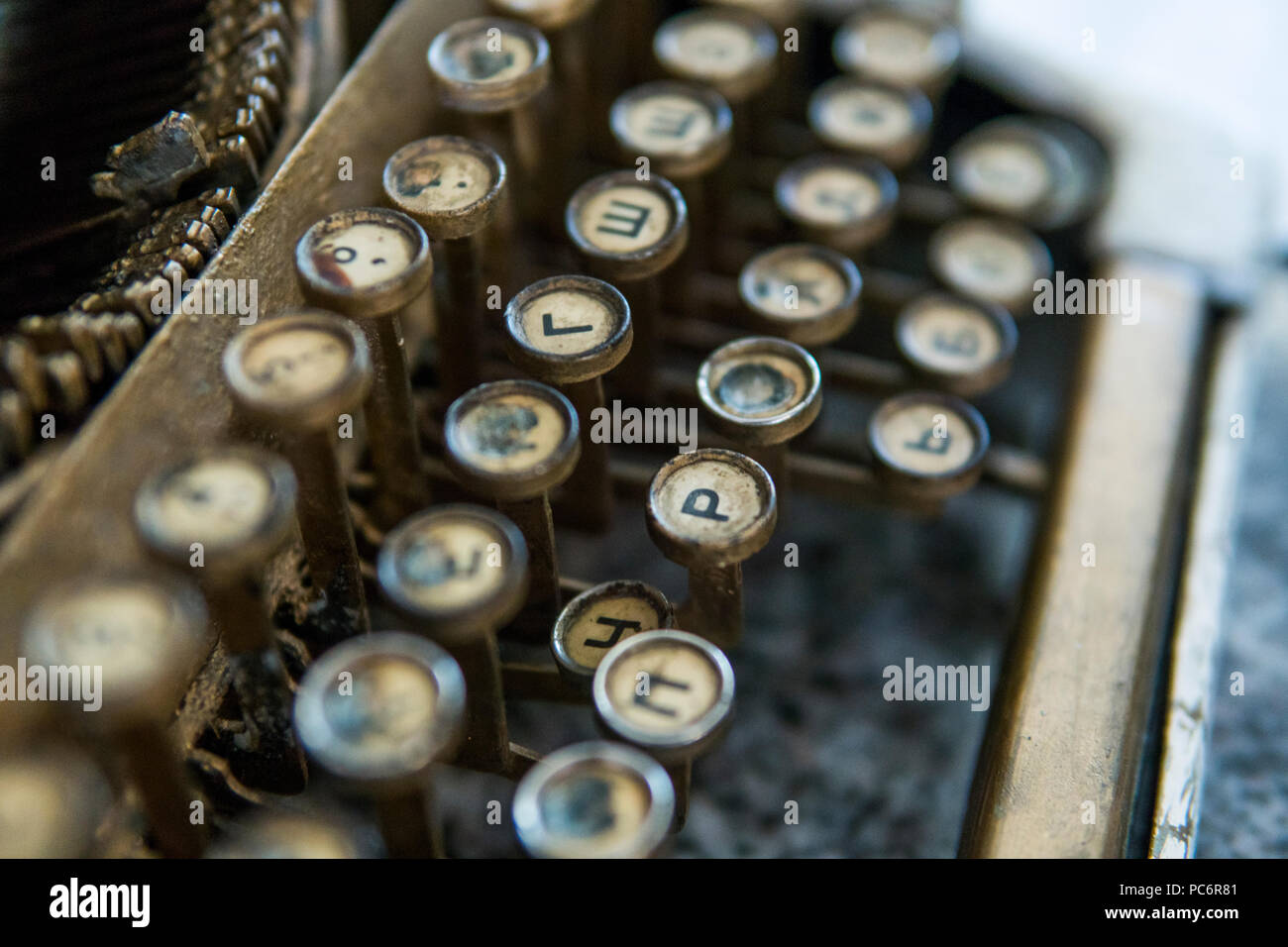 Close up view on an old dirty broken antique typewriter machine keys ...