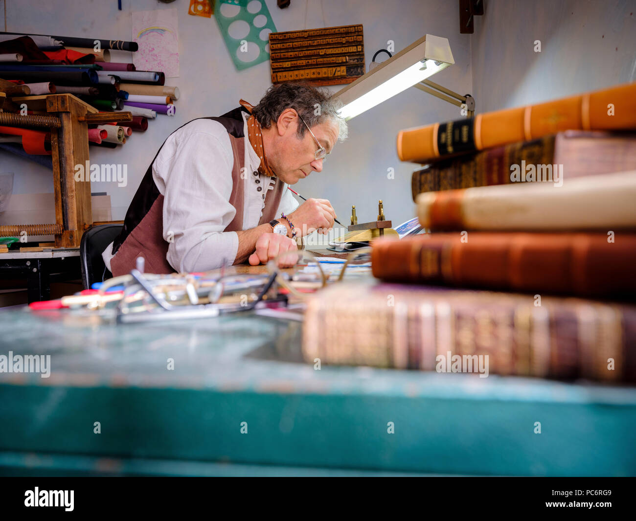 Book edge artist Martin Frost at work in his Worthing studio Stock ...