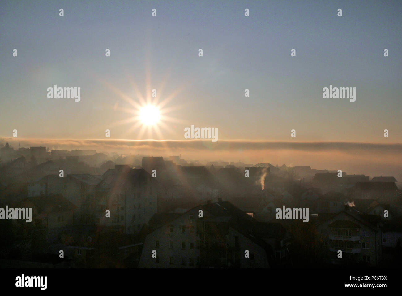 Beautiful view of the winter morning fog and sun filling on the horizon ...