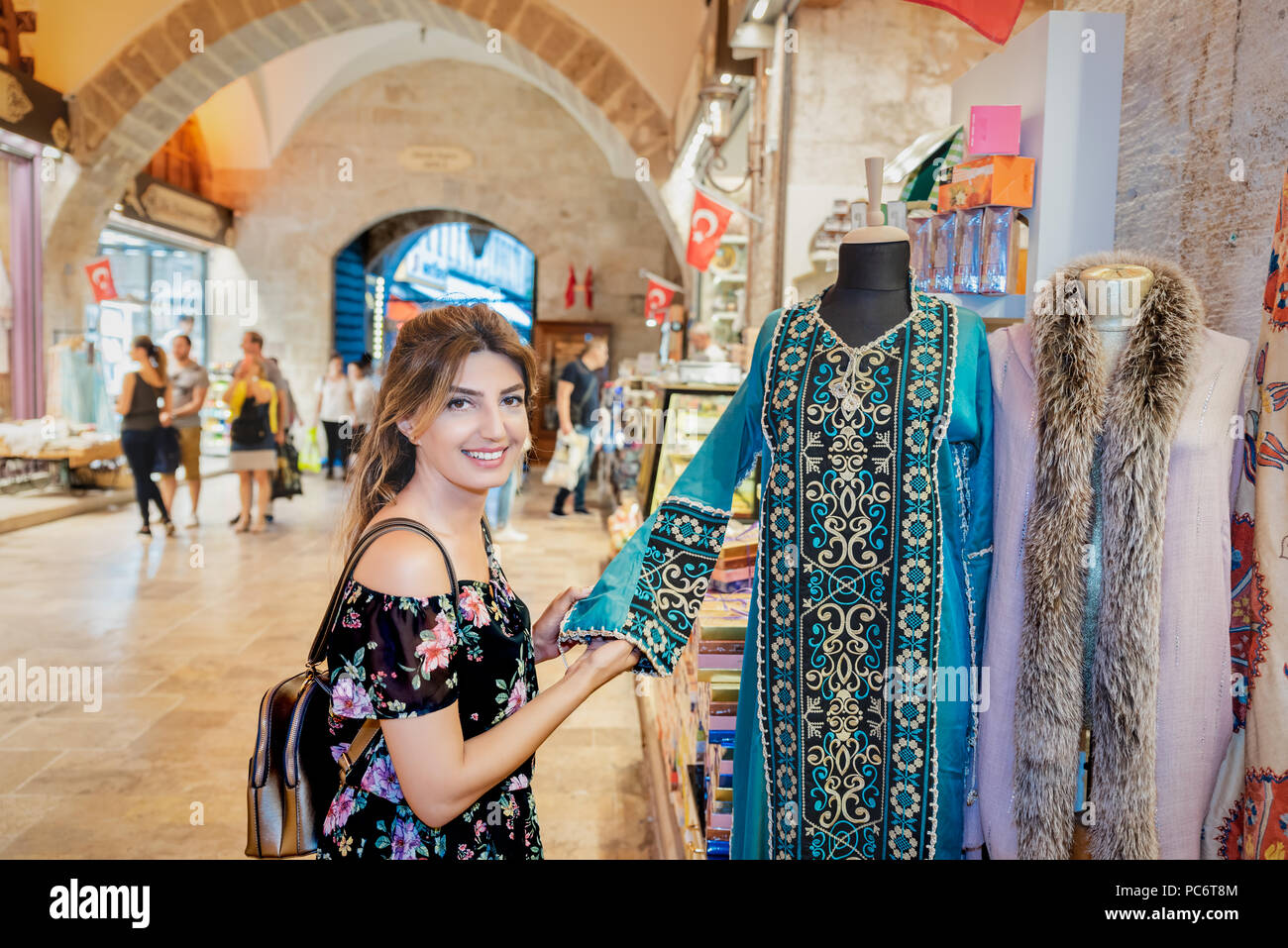 Beautiful woman looks oriental clothes sold a shop in Egypt Bazaar in ...
