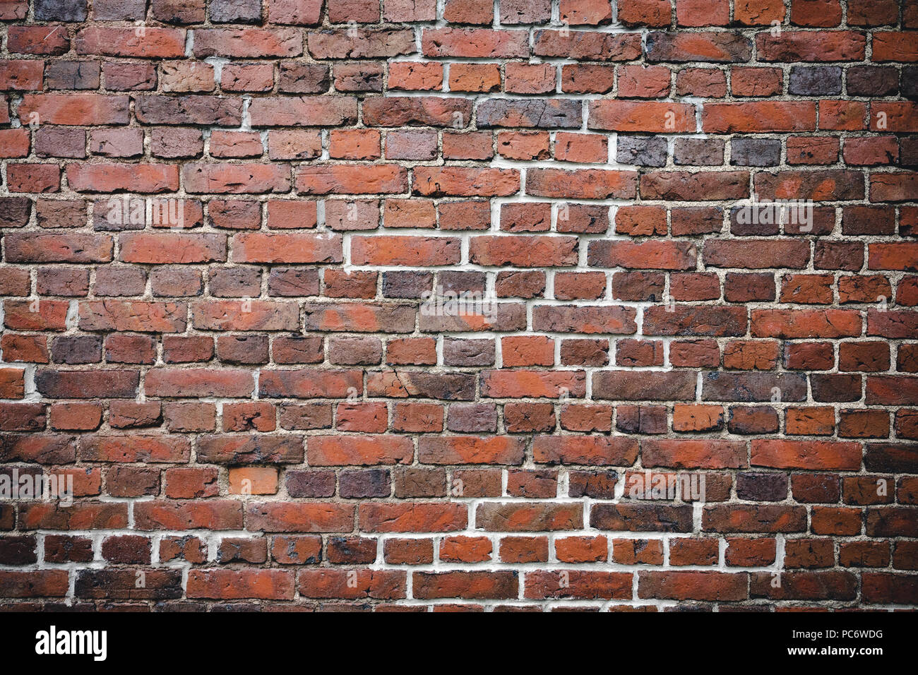 Old worn brick wall exterior pattern texture background Stock Photo - Alamy