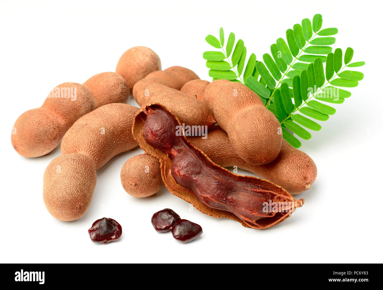fresh tamarind fruits and leaves isolated on white background Stock ...