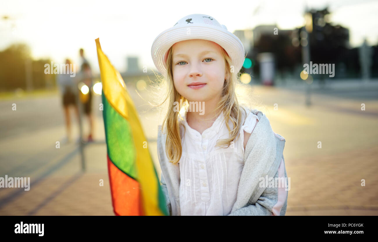 Cute little girl holding tricolor Lithuanian flag on Lithuanian ...