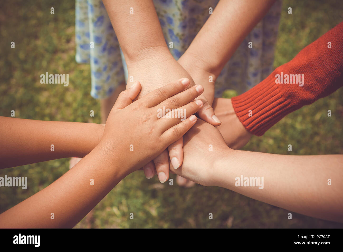 Teamwork unity Arms consolidation Stock Photo - Alamy