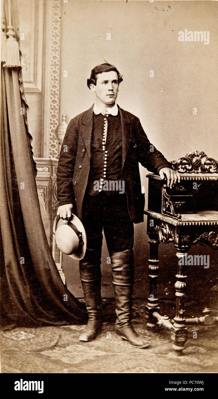32 Ernest Pogorelc - Man posing at desk Stock Photo - Alamy