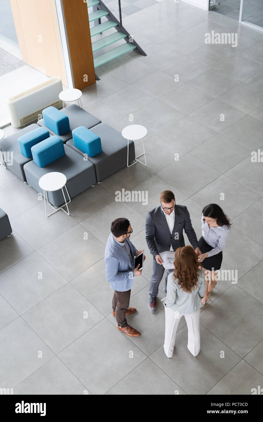 Group of business people collaborating and working on project Stock ...