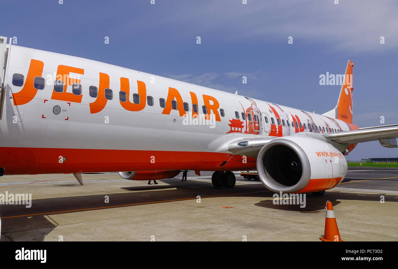 Jeju, South Korea - Sep 21, 2016. Passenger airplane docking at Jeju ...