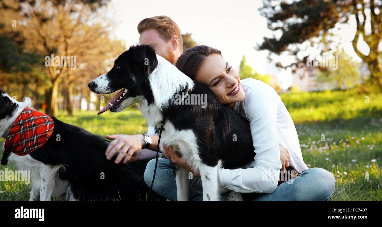 Romantic happy couple in love enjoying their time with pets Stock Photo ...