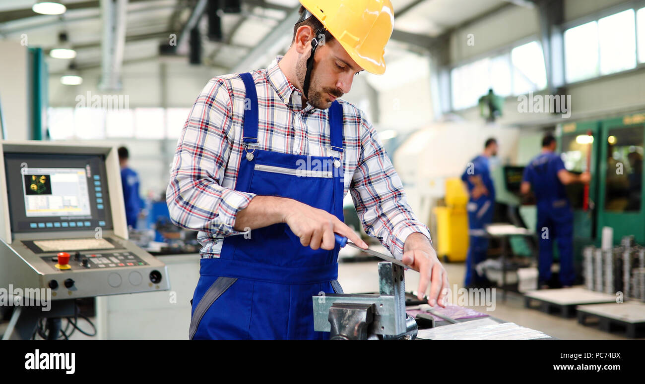 industrial factory employee working in metal manufacturing industry ...
