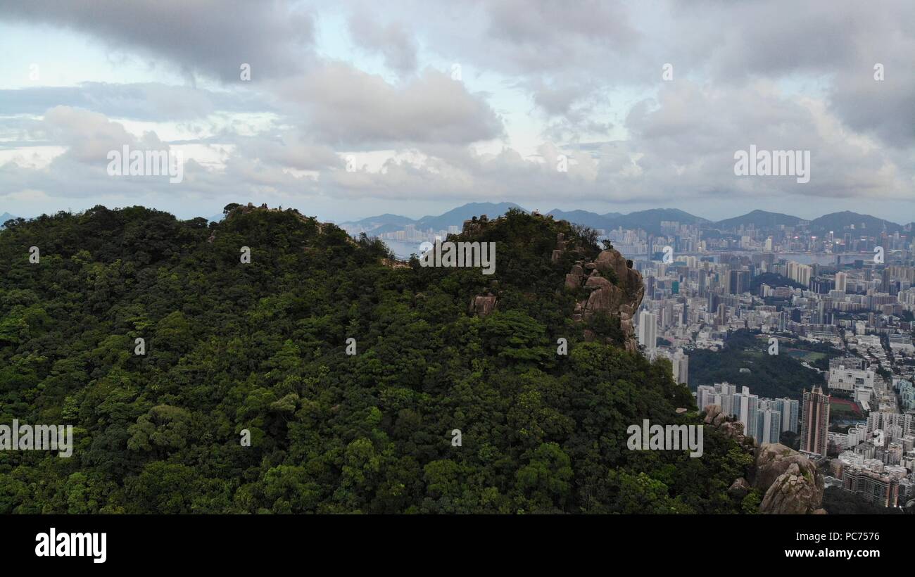 lion rock in hong kong with the city background Stock Photo - Alamy