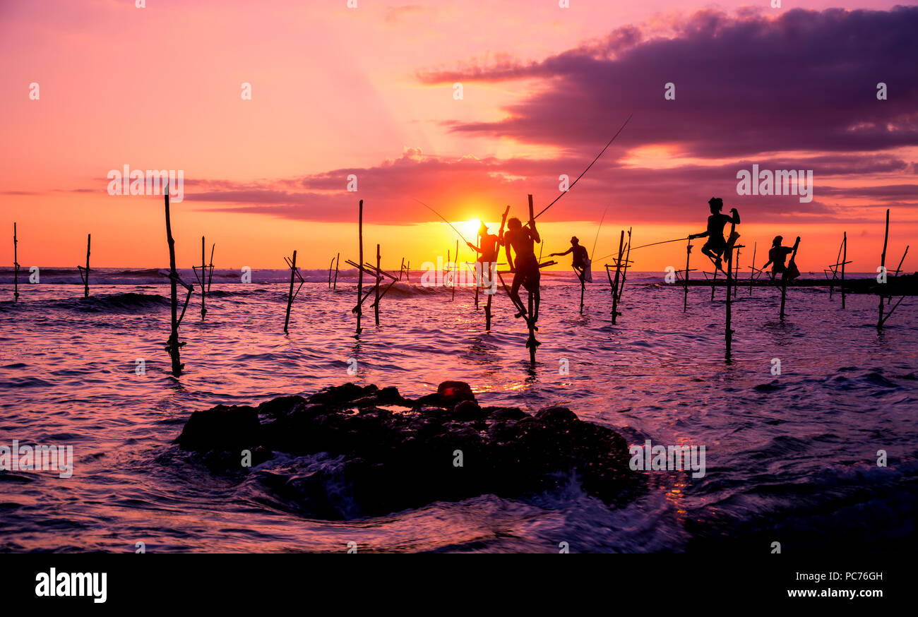Traditional fishermen at the sunset in Sri Lanka Stock Photo - Alamy