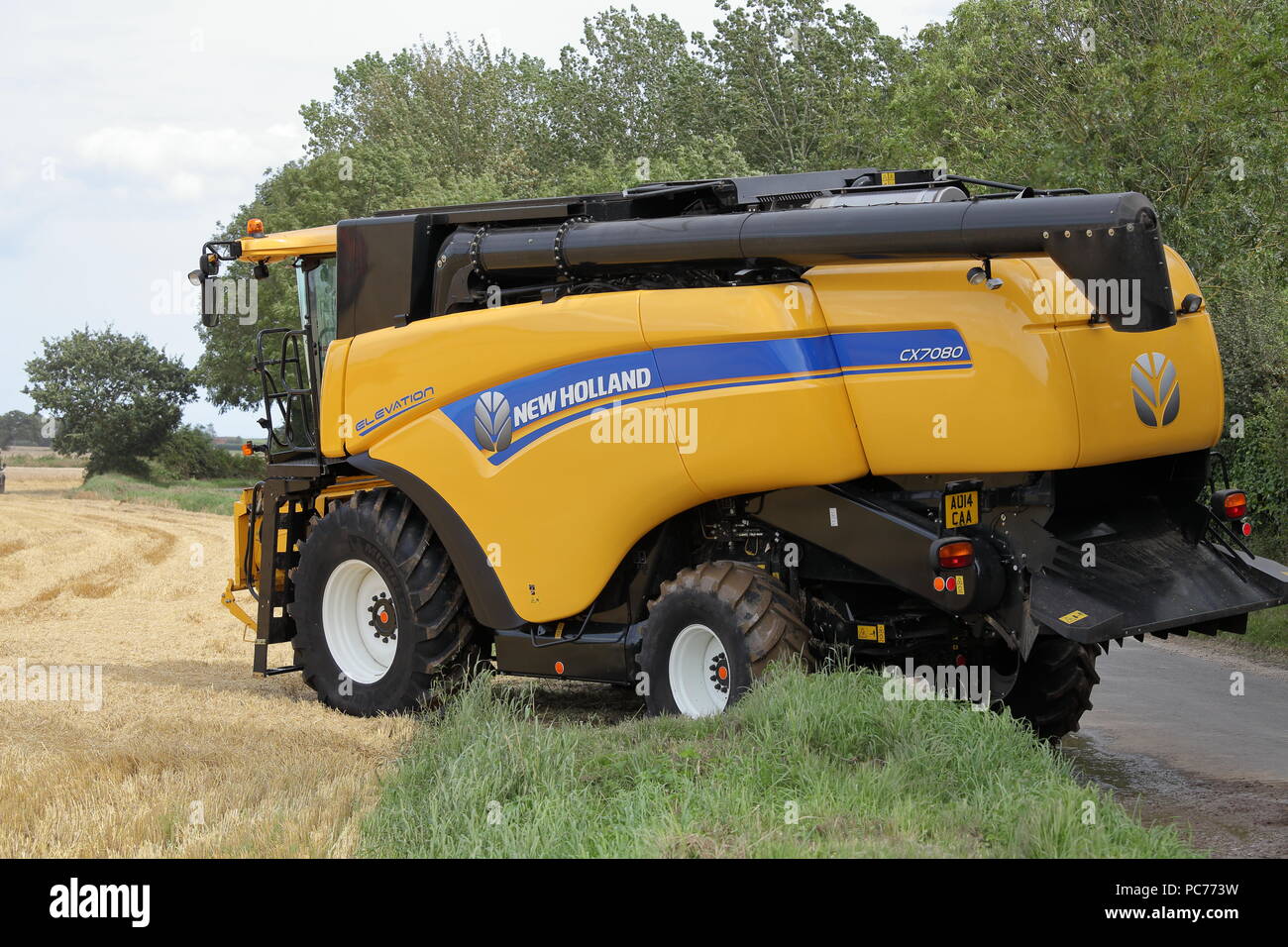 Combine Harvester harvesting Barley in Norfolk, UK Stock Photo - Alamy