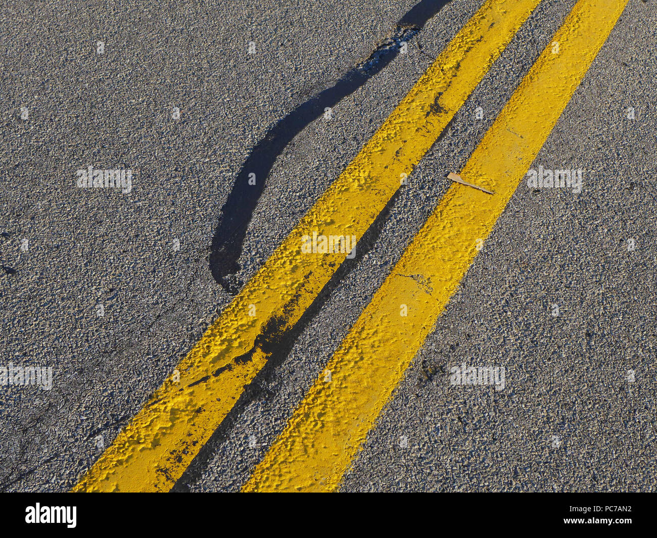 Yellow stripes on highway Stock Photo - Alamy