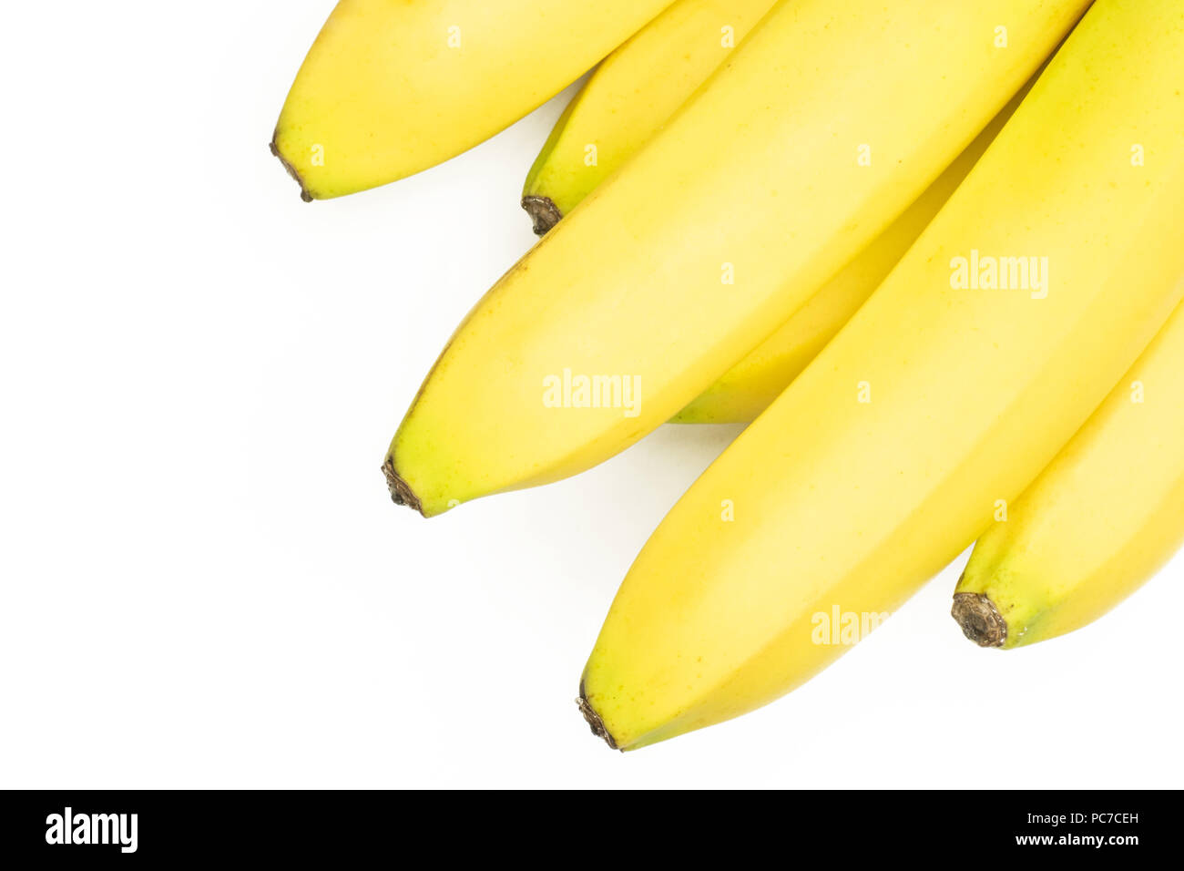Group of six whole fresh yellow banana one cluster flatlay isolated on ...