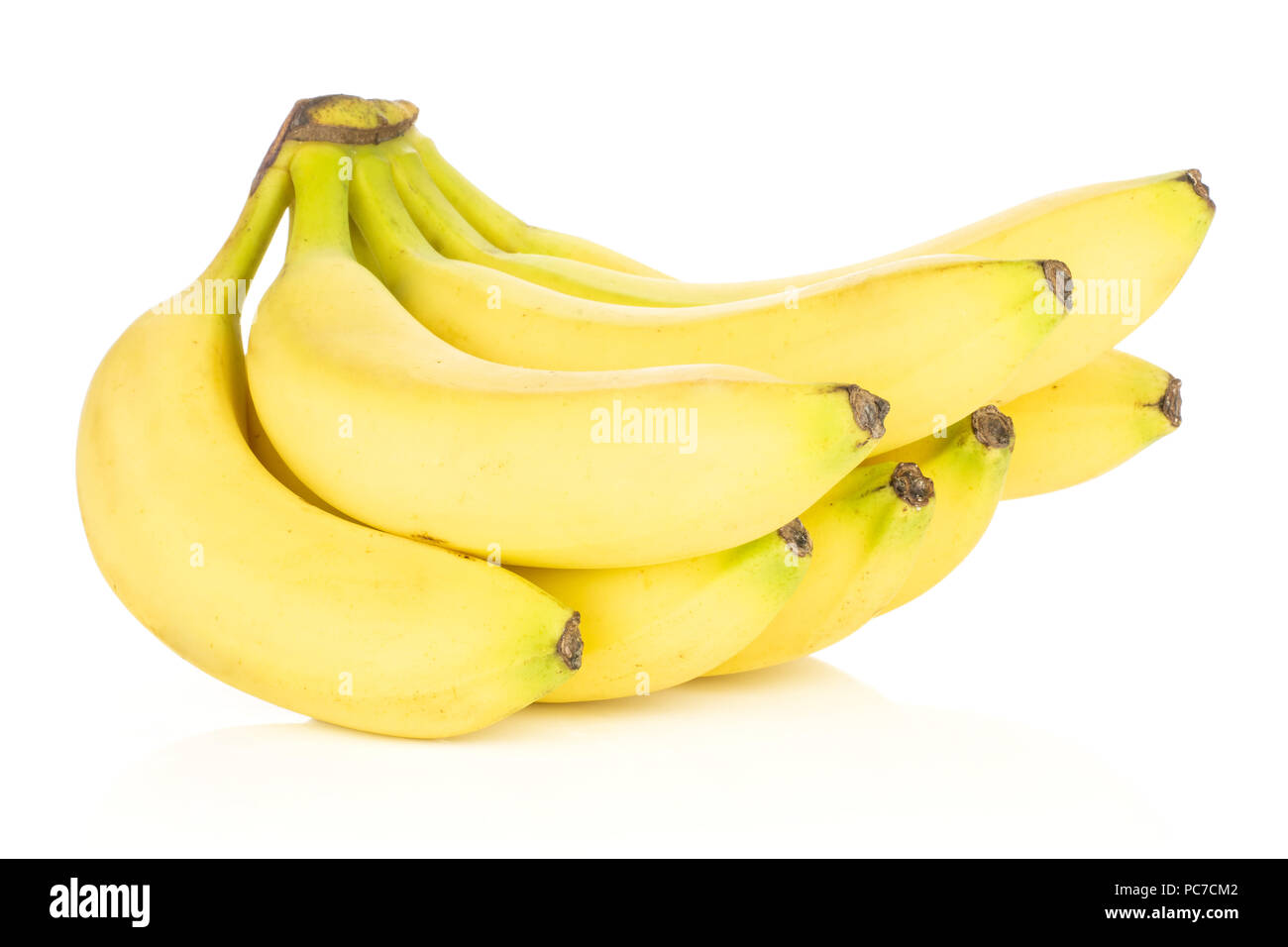 Group of eight whole fresh yellow banana one cluster isolated on white ...