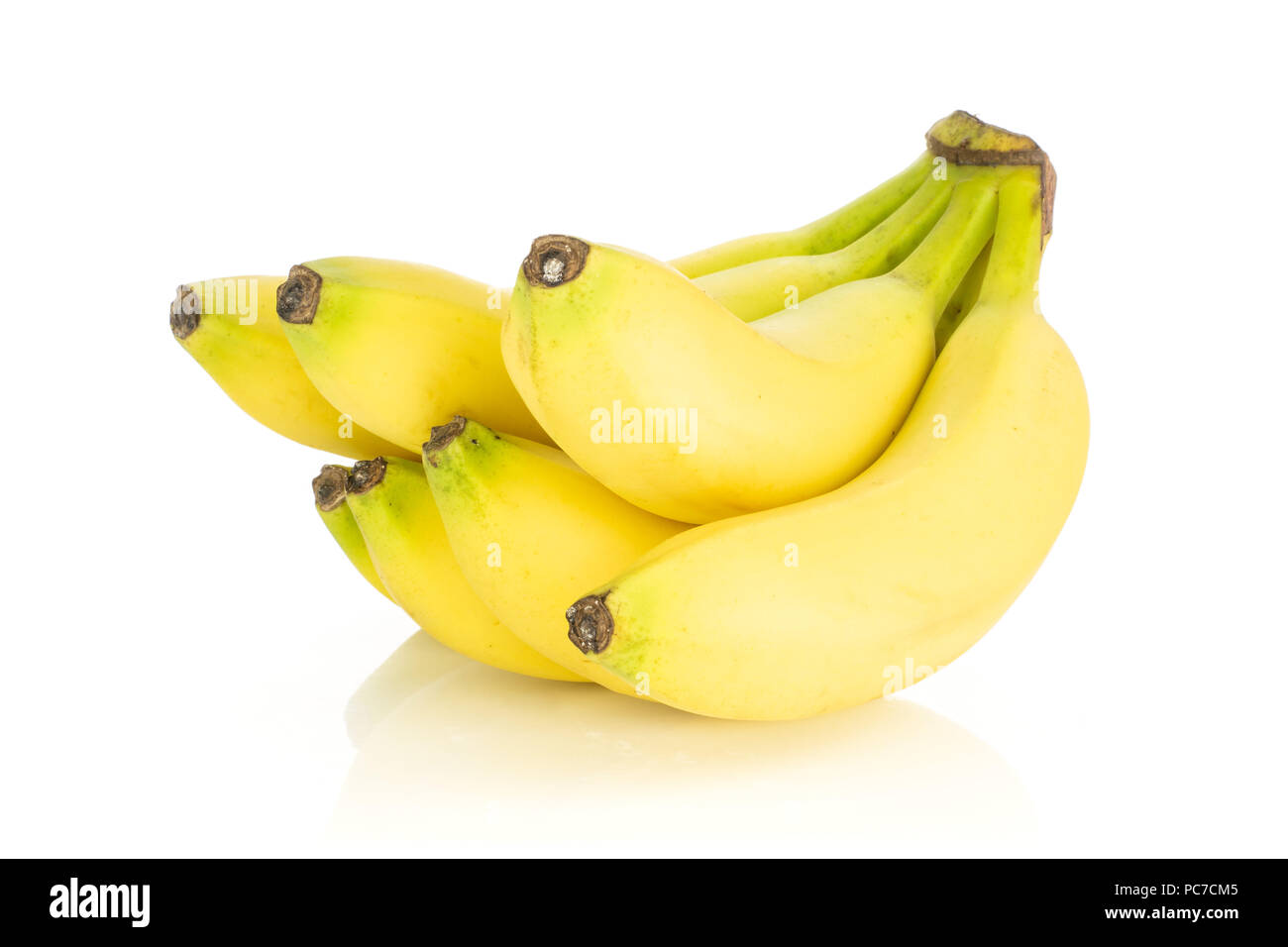 Group of six whole fresh yellow banana one ripe cluster isolated on ...