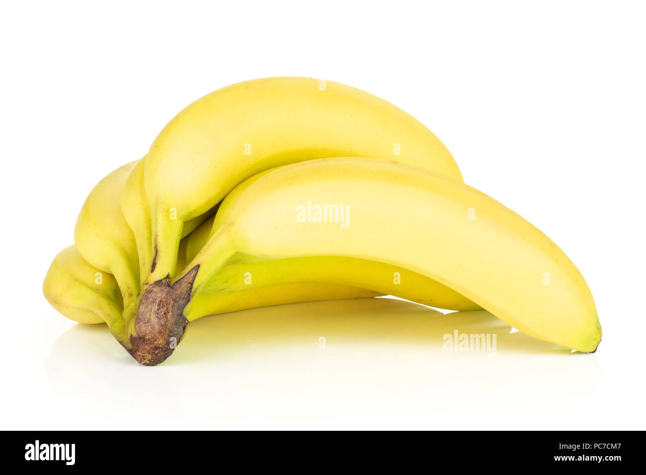 Group of eight whole fresh yellow banana one cluster isolated on white ...