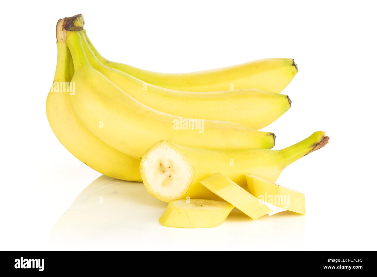 Group of lot of whole one half three slices of fresh yellow banana ...