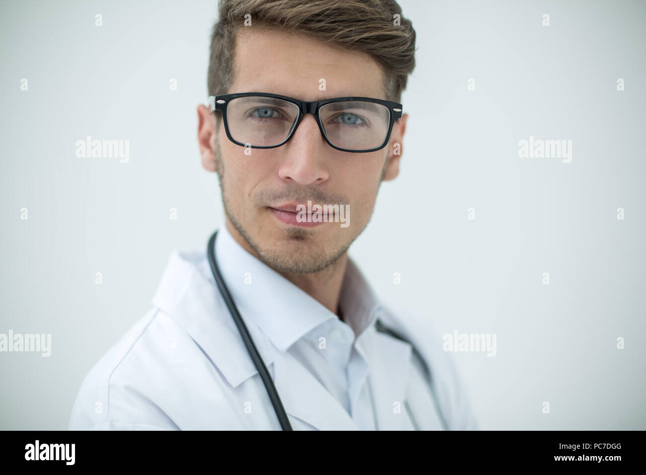 portrait of doctor-diagnostician on a light background Stock Photo - Alamy
