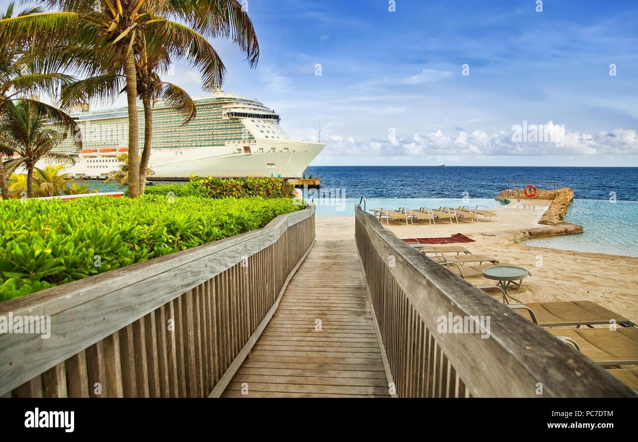 Cruise Ship in port. View from wooden pathway on cruise ship docked at ...