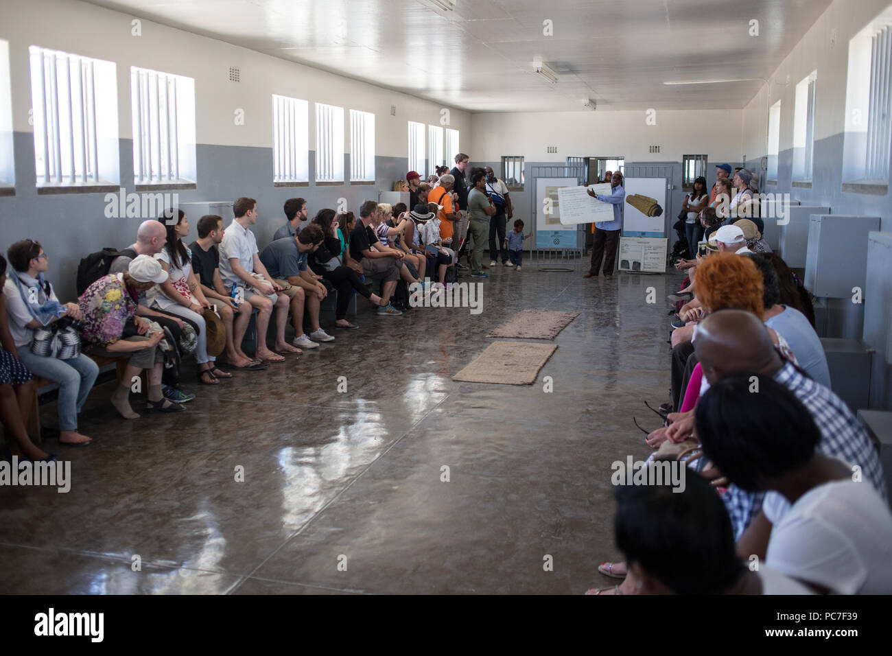 ROBBEN ISLAND PRISON, SOUTH AFRICA,February 2015, Tourists listening to ...