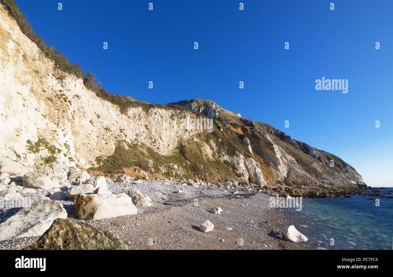 View of headland with small bay flanked by cliffs, White Nothe, Dorset ...