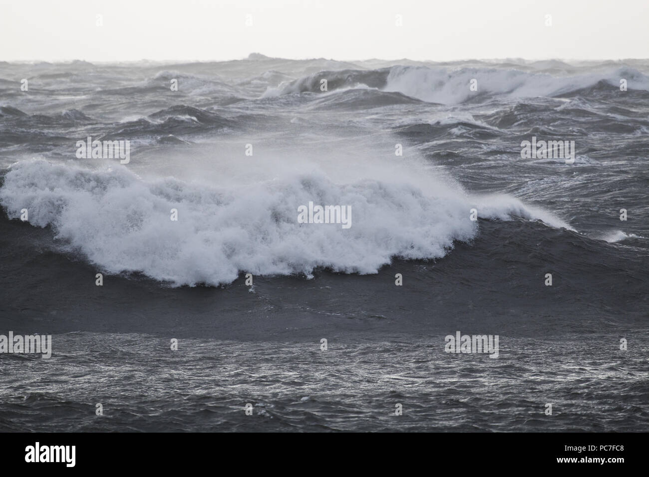 View of large waves and surf, Portland, Dorset, England, January Stock ...