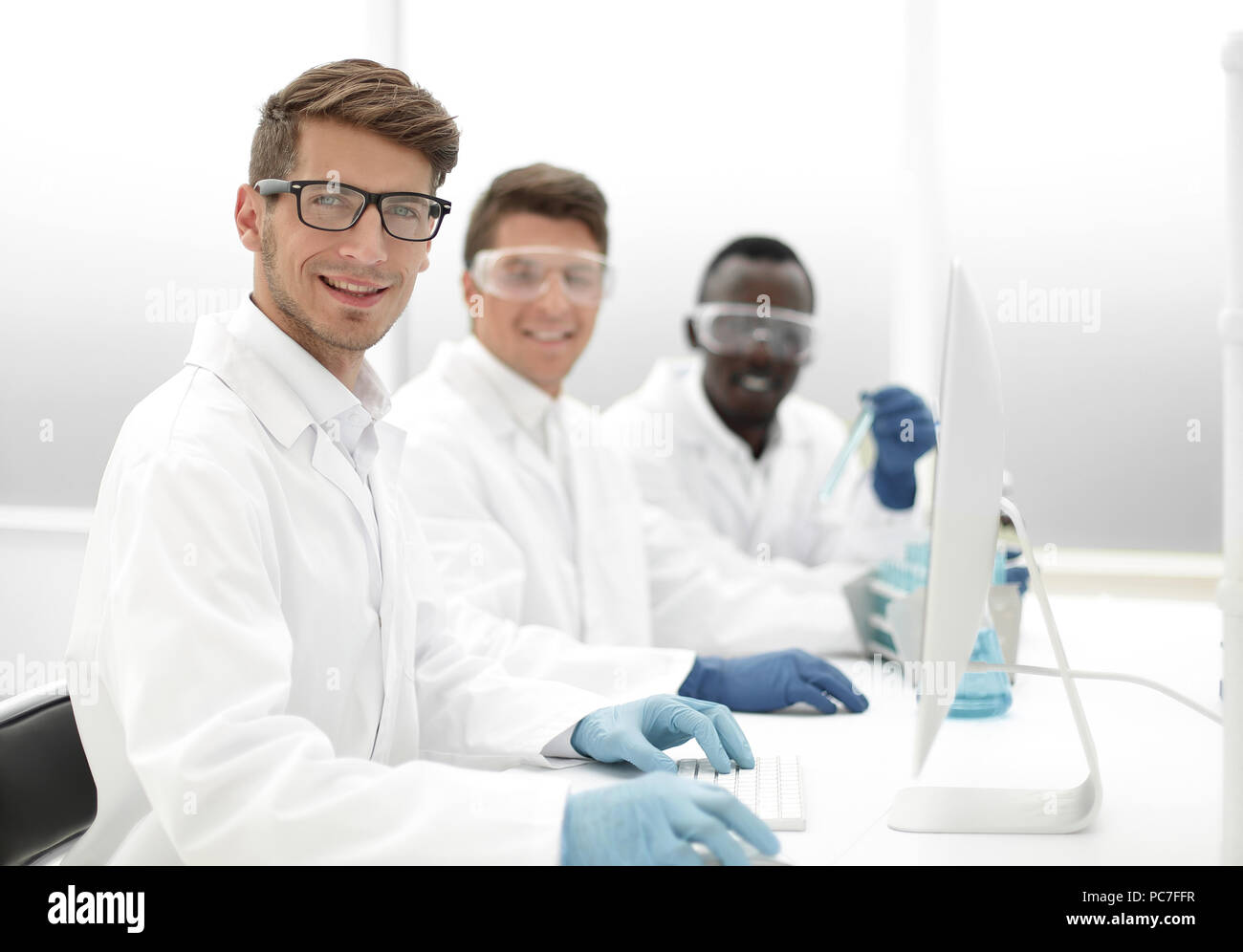 Team scientists sitting in hi-res stock photography and images - Alamy
