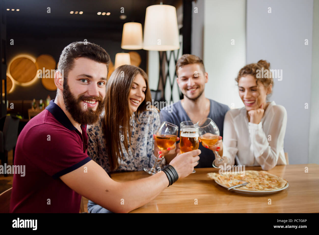 Three men eating together restaurant hi-res stock photography and ...