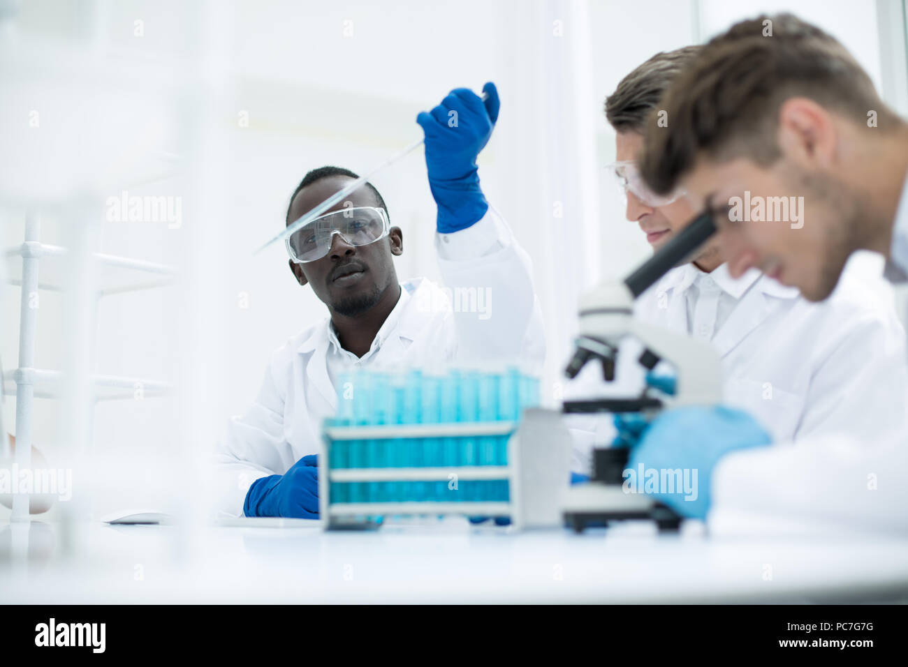 rear view. a group of scientists at the laboratory table Stock Photo ...