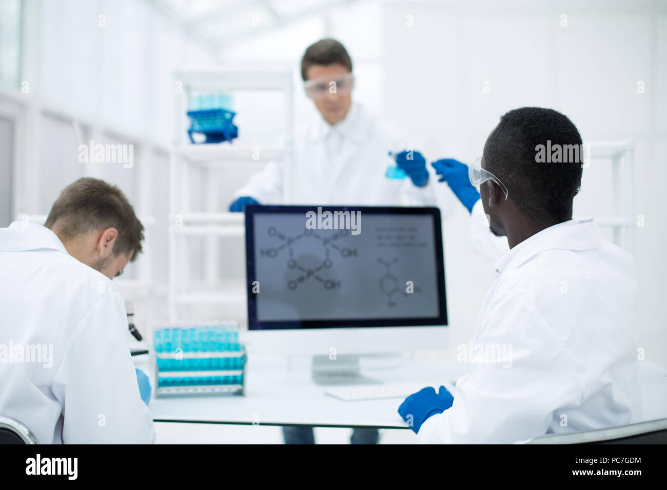 Group young scientist experimenting hi-res stock photography and images ...