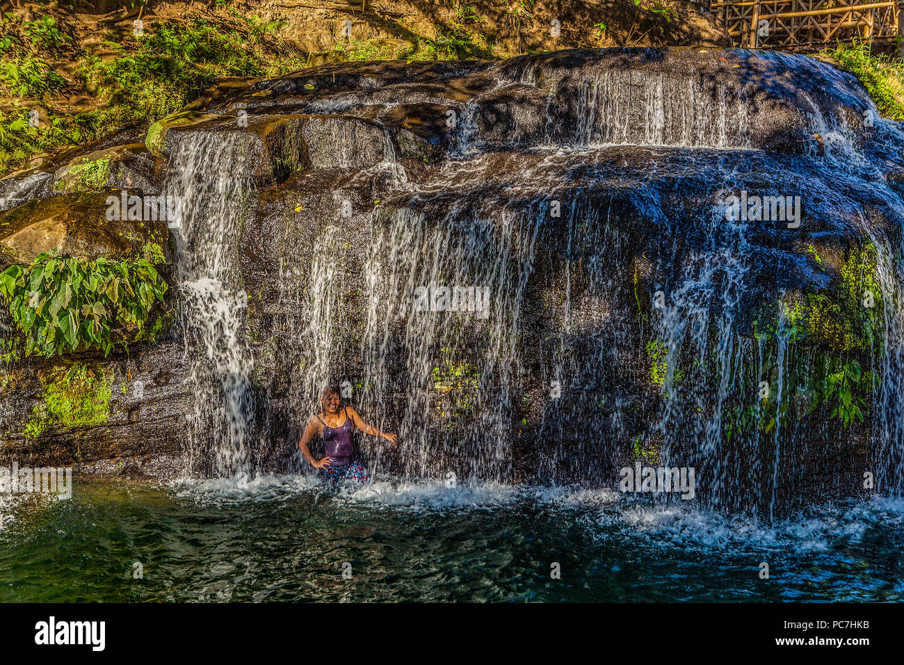 Person under waterfall hi-res stock photography and images - Alamy