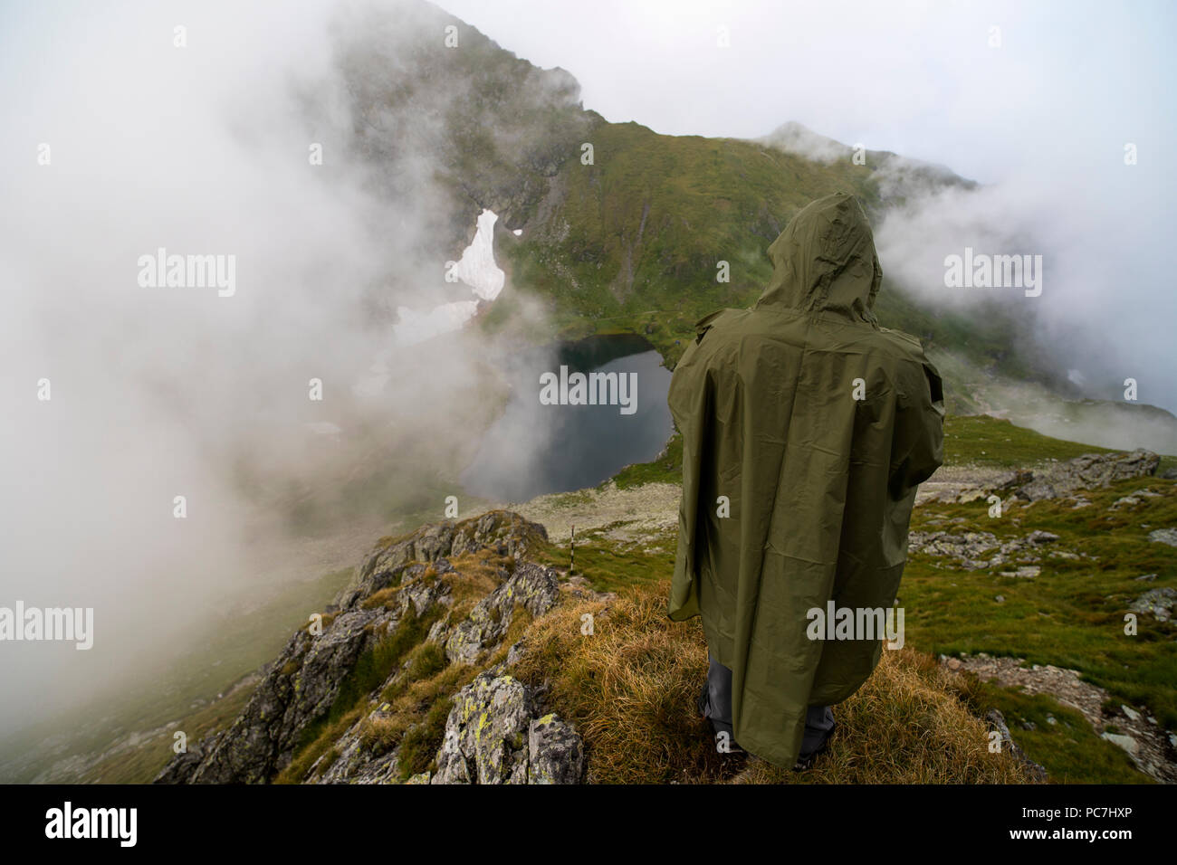 Tourist on mountain raincoat hi-res stock photography and images - Alamy