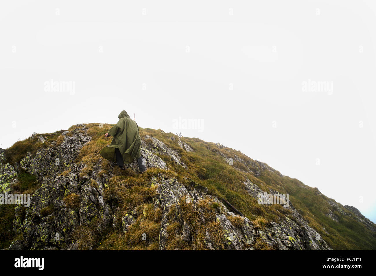 tourist on the mountain with a raincoat Stock Photo - Alamy